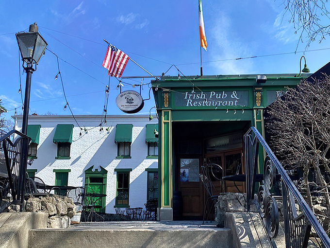 The distinctive green exterior of Molly Malone's stands proudly in Louisville's Highlands, flying both American and Irish flags—a Celtic oasis in Kentucky bourbon country.
