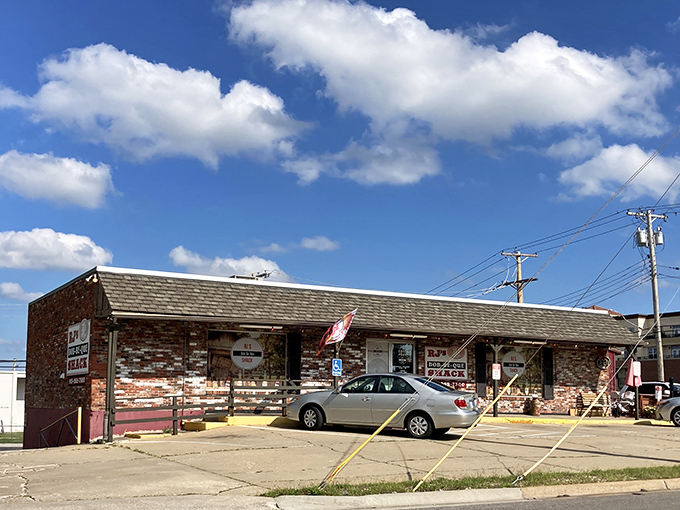The weathered brick exterior of R.J.'s isn't trying to impress anyone—it's saving all that energy for what happens inside those humble walls.