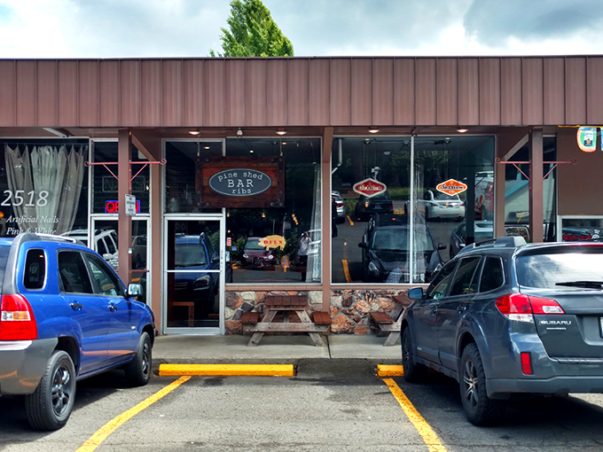 The rustic wooden exterior of Pine Shed Ribs isn't trying to impress anyone—until you smell what's cooking inside. Barbecue authenticity at its finest.