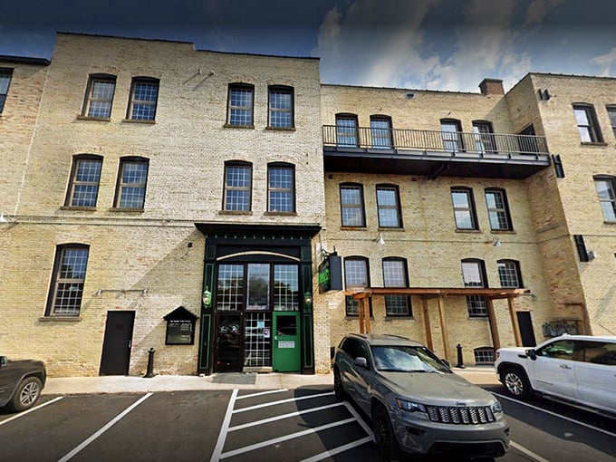 The historic brick façade of North Peak Brewing Company stands proud on Front Street, a Traverse City landmark that's been reinvented as a temple to craft beverages and comfort food.