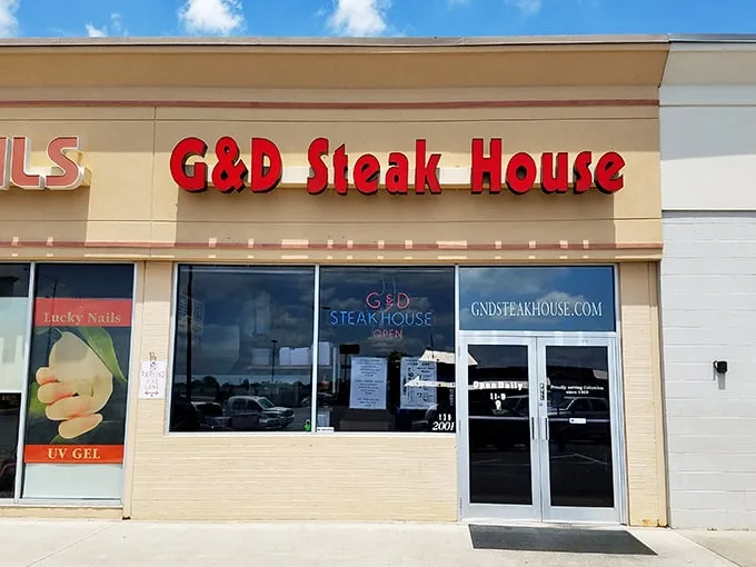 The red letters of G & D Steakhouse beckon like a beacon for beef lovers. No fancy frills, just the promise of serious steak satisfaction inside.