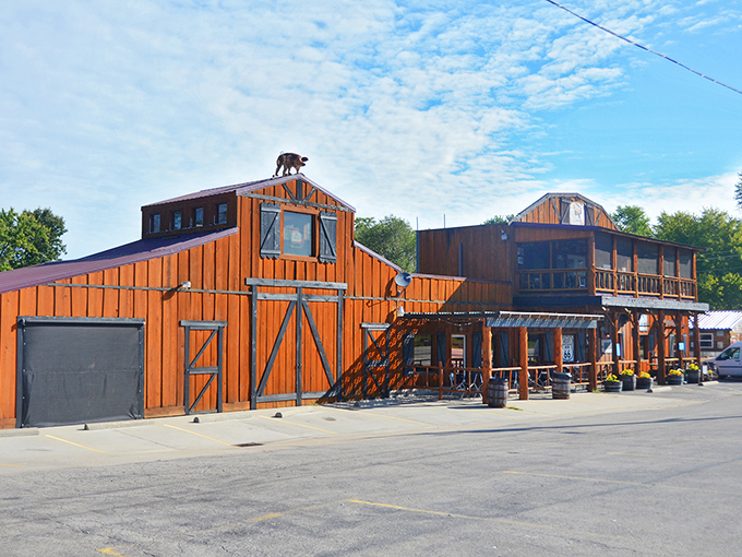 Step into barbecue paradise where that barn-style exterior isn't just rural charm—it's a smoke signal calling hungry travelers from miles around.
