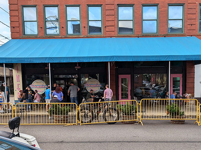 Pittsburgh's breakfast mecca announces itself with a cheerful blue awning and pink accents. The line forms early—locals know some traditions are worth the wait.
