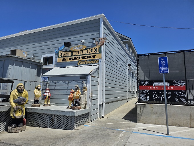 The unassuming blue exterior of Phil's Fish Market & Eatery stands like a salty sea captain – weathered, unpretentious, and hiding treasures within.