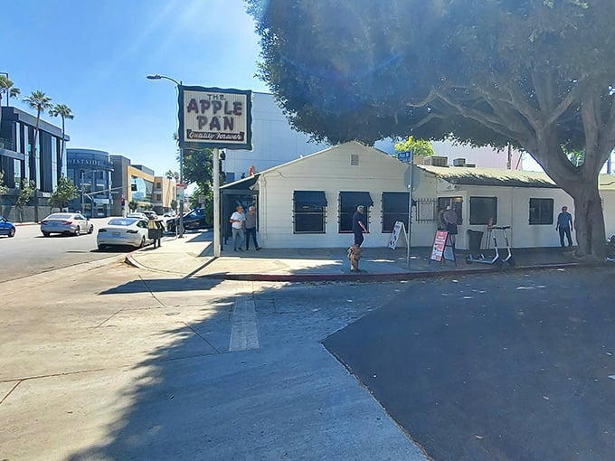 The unassuming exterior of The Apple Pan stands like a time capsule amid modern LA, its vintage sign promising "Quality Forever" – a bold claim they've somehow managed to keep.
