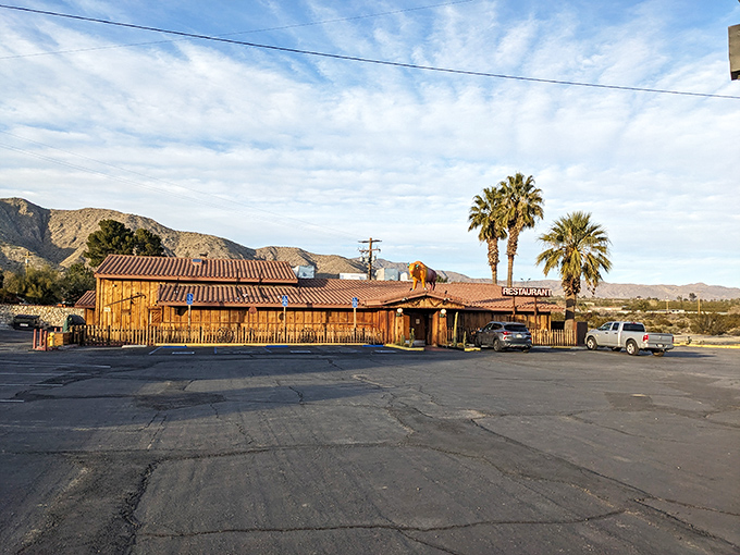 The giant yellow and pink buffalo on the roof isn't a desert mirage—it's your signal that pasta paradise awaits at Spaghetti Western in Morongo Valley.