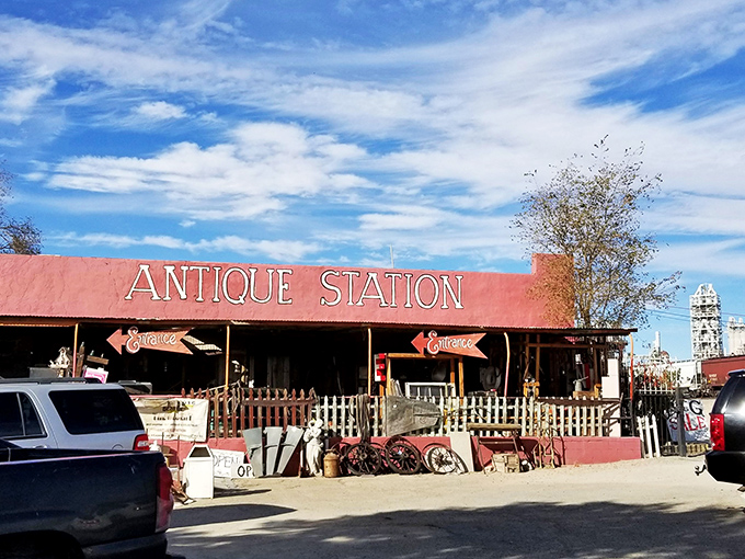 The desert sky creates a perfect backdrop for Antique Station's vibrant red façade. Route 66 charm doesn't get more authentic than this roadside treasure trove.