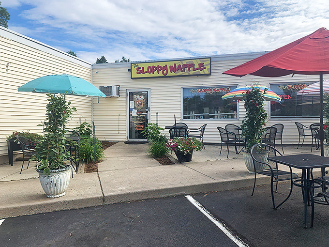 The unassuming exterior of The Sloppy Waffle shares space with The Angry Chair Salon—a pairing that somehow makes perfect sense in Connecticut's charming landscape.