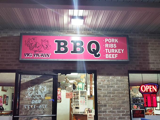 The pink sign beckons like a smoky siren call. Young's BBQ's unassuming brick exterior promises no frills—just exceptional barbecue waiting inside.