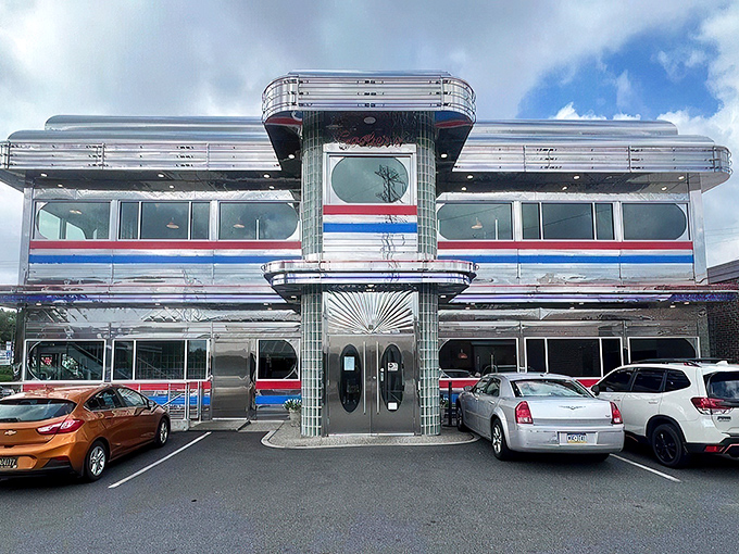 The gleaming chrome exterior of Goobers Diner shines like a beacon of breakfast hope, a retro time machine promising delicious nostalgia inside.