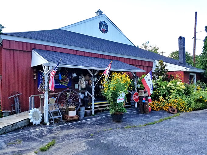 The red barn exterior of The Zeppelin and The Unicorn beckons like a portal to another time. Vibrant flowers and vintage flags hint at the treasures within.