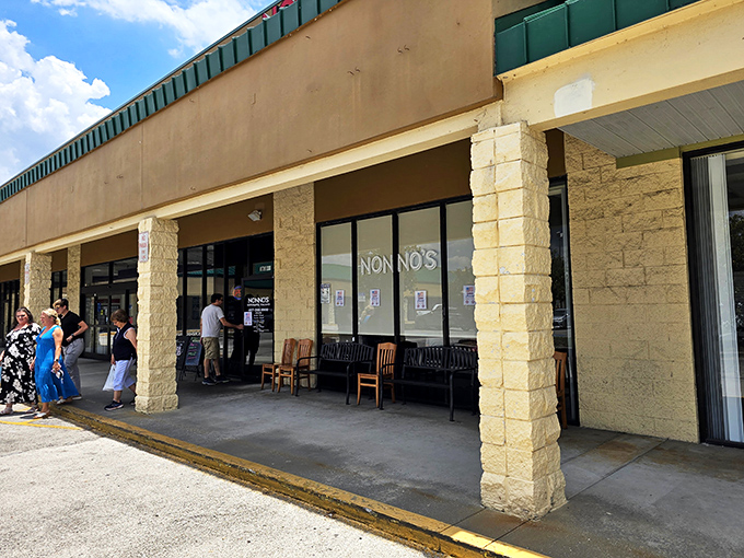 The unassuming storefront hides culinary treasures within, like finding a Ferrari parked at a strip mall. The Italian flag on the door signals authentic delights await.