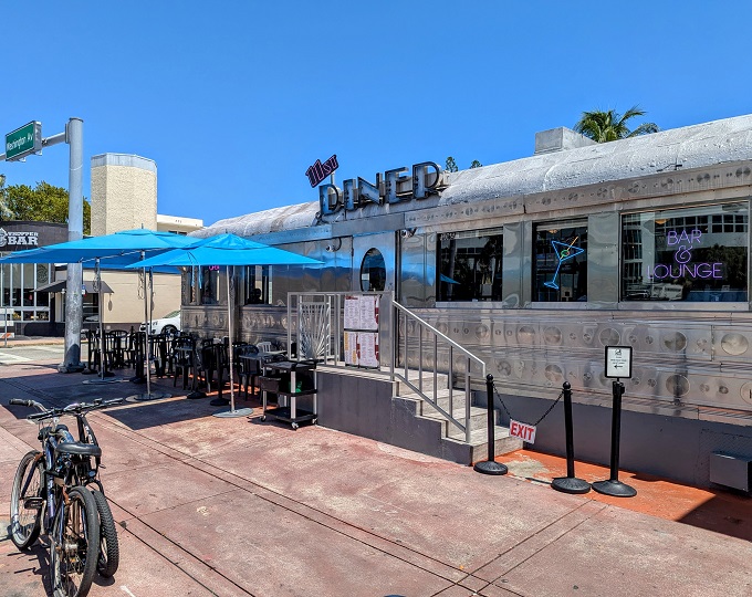 The gleaming stainless steel exterior of 11th Street Diner shines like a time machine in the Miami sun, complete with neon promises of milkshakes that'll make your inner teenager do cartwheels.