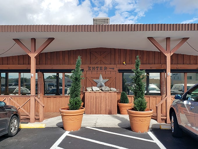 The rustic wooden facade of Gold Rush BBQ beckons like a frontier outpost for hungry travelers. That star above the entrance? It's earned.