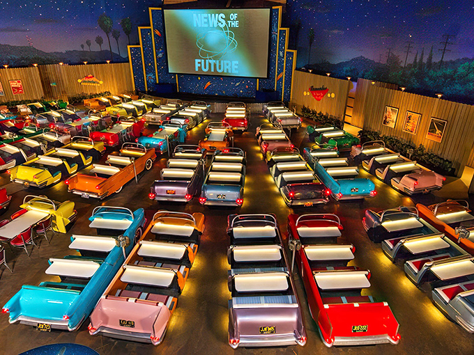 The entrance sets the stage perfectly—a vintage convertible parked beneath a retro marquee that promises cinematic dining adventures ahead.