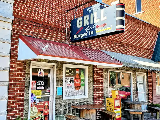 The sign doesn't lie—this unassuming brick storefront houses burger magic that's drawn pilgrims from across Georgia for good reason.