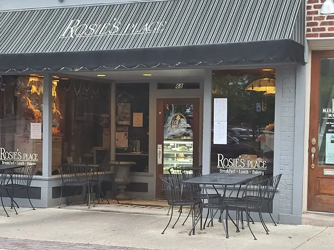 The charming storefront of Rosie's Place beckons with its classic awning and inviting outdoor seating. Downtown Noblesville's breakfast gem awaits.