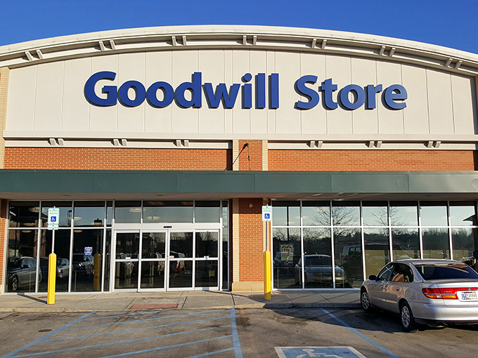 The Fishers Goodwill welcomes bargain hunters with its distinctive curved roofline and bold blue signage—a cathedral of second-hand treasures awaiting discovery.