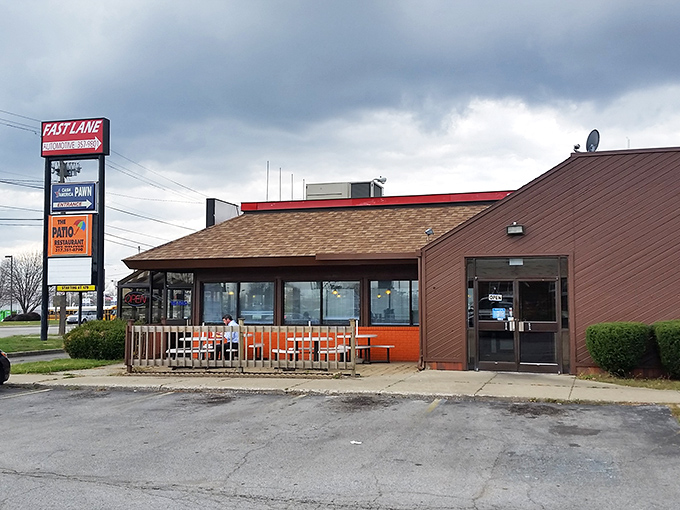 The unassuming exterior of The Patio stands like a beacon of hope for hot dog enthusiasts, its orange-trimmed patio promising simple pleasures in a complicated world.