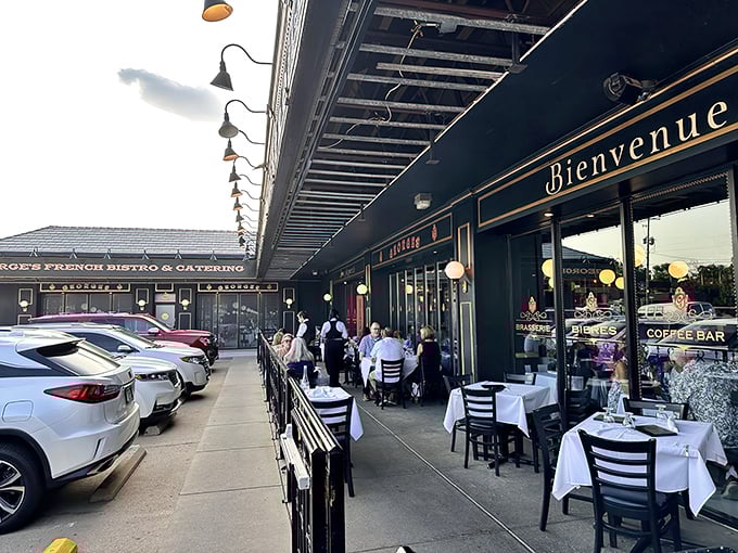 The black and gold façade of Georges French Bistro stands proudly against the Kansas sky, promising Parisian delights with Midwestern hospitality.