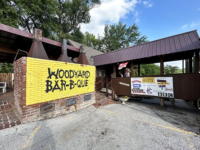 That bright yellow wall isn't just eye-catching—it's a beacon for barbecue pilgrims. Woodyard's humble exterior houses smoking treasures that have made it a Kansas City legend.