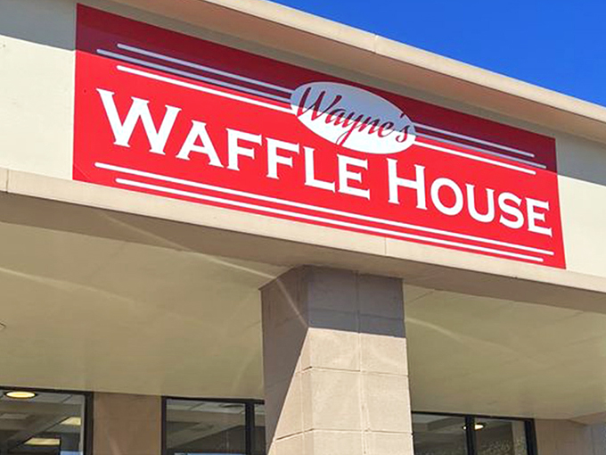 The bright red sign beckons like a lighthouse for the breakfast-starved. Wayne's Waffle House stands ready to fulfill your deepest carb fantasies.