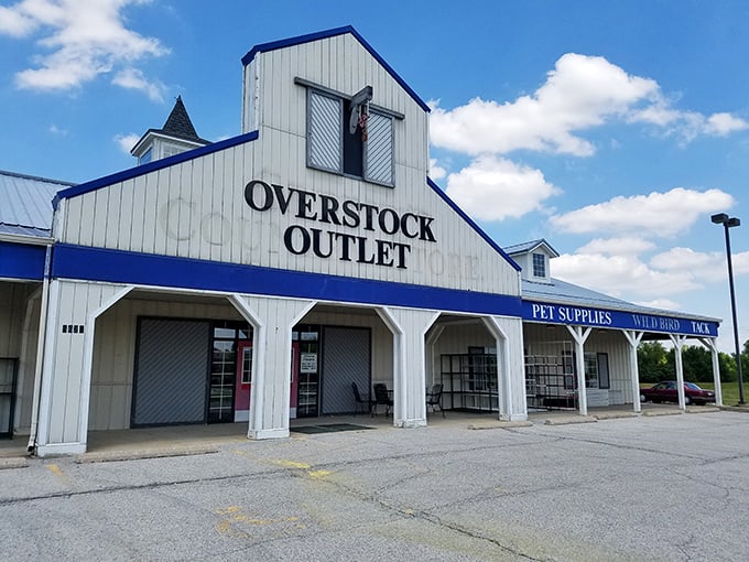 The unassuming barn-style exterior of Overstock Outlet promises treasure within—like finding a secret gold mine disguised as a humble homestead.