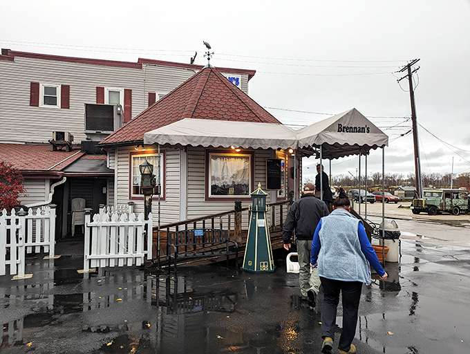 The unassuming white clapboard exterior of Brennan's Fish House stands like a beacon for seafood lovers, its distinctive red-shingled roof a landmark in Grand River.