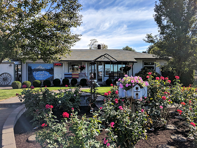The charming craftsman exterior of Country Bakery beckons like an old friend, promising sweet comfort just beyond that welcoming porch.
