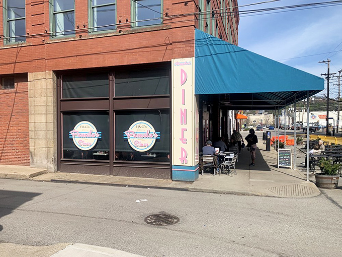 Pittsburgh's breakfast mecca announces itself with a cheerful blue awning and pink accents. The line forms early—locals know some traditions are worth the wait.