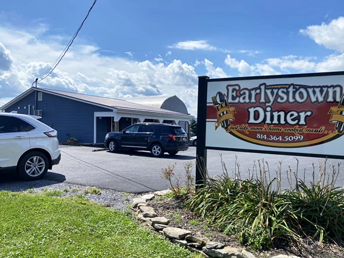 The unassuming exterior of Earlystown Diner belies the culinary treasures within. Those hanging purple petunias aren't just for show—they're your first clue that someone here cares about details.