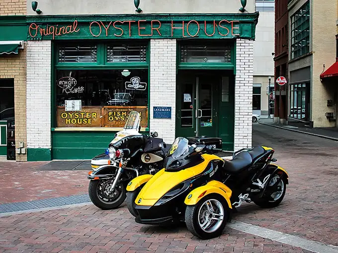 The neon glow of seafood salvation! Pittsburgh's Original Oyster House stands like a time capsule in Market Square, its red sign beckoning hungry souls since long before Instagram existed.
