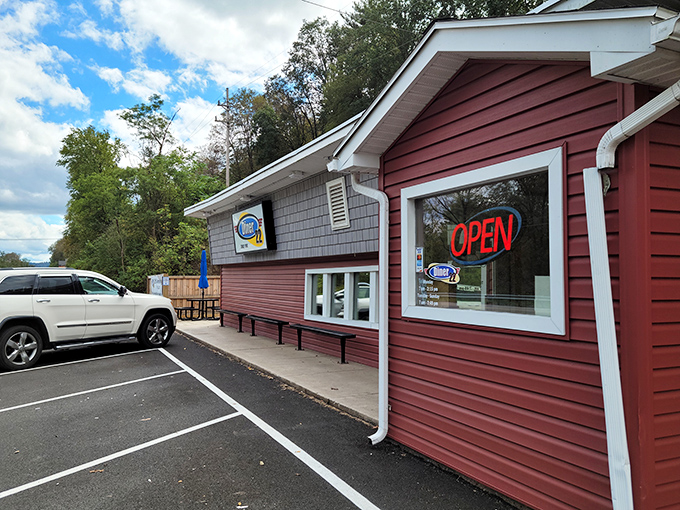 Welcome to flavor town! This cozy red exterior isn't just a diner, it's a portal to comfort food paradise. 