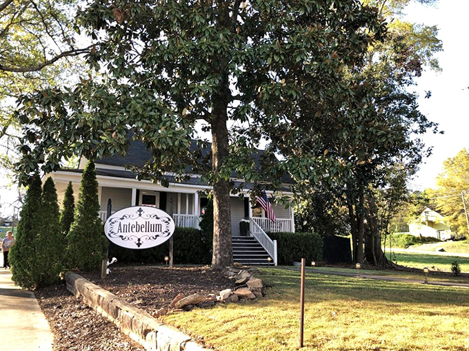 A Southern welcome if there ever was one. This charming white farmhouse with its inviting porch promises culinary magic within its historic walls. 