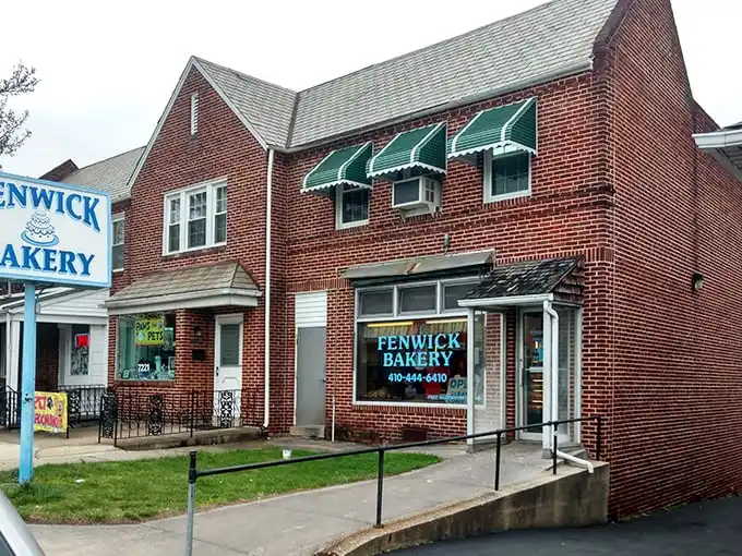 The classic brick exterior of Fenwick Bakery stands as Baltimore's sweet landmark since 1913, complete with those charming green awnings that practically whisper "come inside."