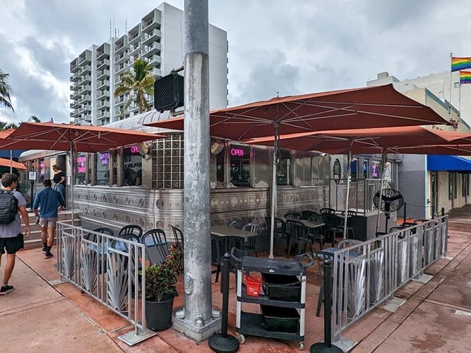 The gleaming stainless steel exterior of 11th Street Diner shines like a time machine in the Miami sun, complete with neon promises of milkshakes that'll make your inner teenager do cartwheels.