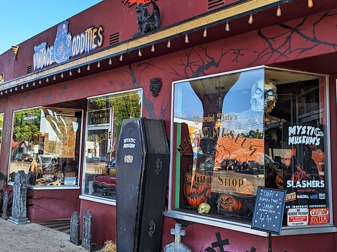 The vintage shop exterior glows with retro charm, beckoning curious souls with its crimson façade and twinkling carnival lights. Adventure awaits! 