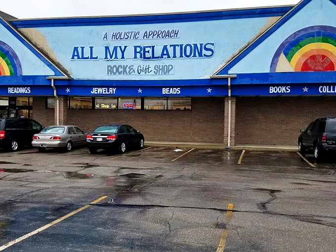 The rainbow-painted facade promises cosmic adventures within, where "CRYSTALS" and "READINGS" boldly announce this isn't your average strip mall tenant.