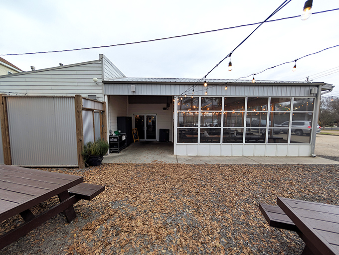 The iconic pig silhouette welcomes barbecue pilgrims to this Fondren district gem, where string lights promise good times ahead.