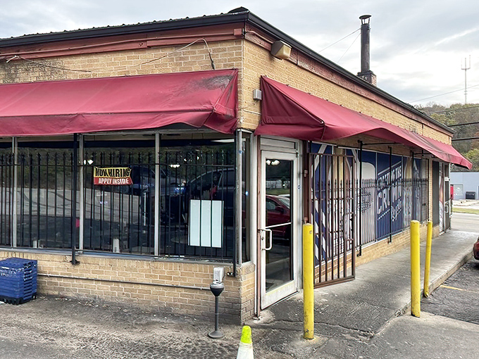 The unassuming exterior with its bright red awning houses barbecue magic that's drawn pilgrims from across Missouri for decades.