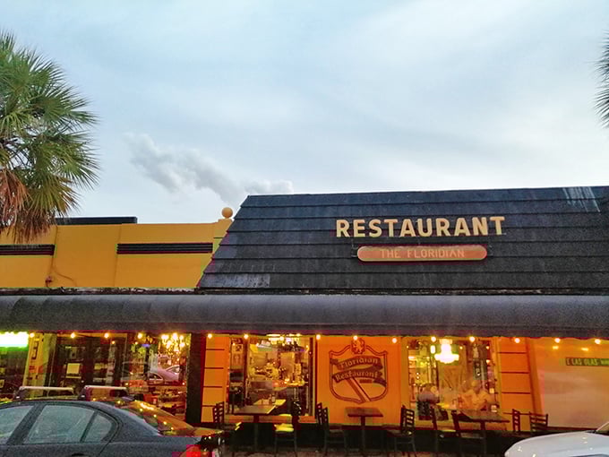 The sunshine-yellow exterior stands like a beacon of breakfast hope on Las Olas Boulevard, promising culinary salvation to the hungry masses of Fort Lauderdale.