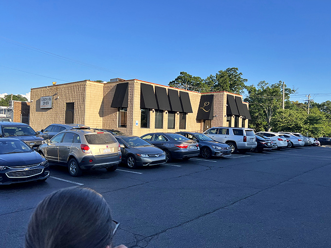 The unassuming exterior of Landmark Diner stands as Charlotte's culinary fortress – modest architecture hiding extraordinary flavors within.