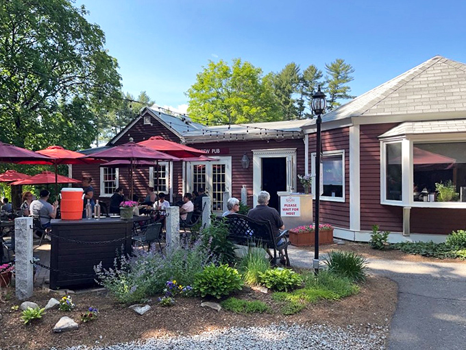 The unassuming burgundy exterior of Rapscallion Table & Tap holds culinary treasures that belie its modest appearance, like finding a Michelin star in a phone booth.