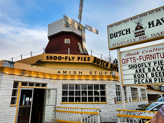 The windmill-topped yellow building isn't subtle about its mission—proclaiming "America's Best Shoo-Fly Pie" with the confidence of someone who knows they're right.