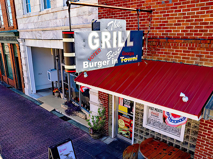 The sign doesn't lie—this unassuming brick storefront houses burger magic that's drawn pilgrims from across Georgia for good reason.