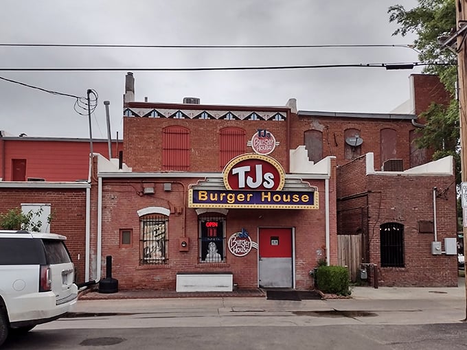 That iconic yellow and red sign against classic brick isn't just restaurant signage—it's a beacon of burger hope for hungry Kansans everywhere.