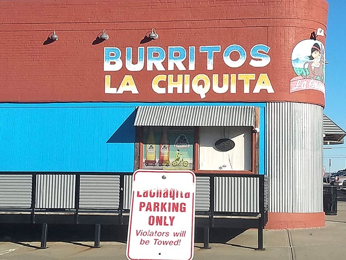 The bright blue entrance against brick-red walls isn't just eye-catching—it's a beacon for burrito lovers across Kansas City. No fancy frills, just fantastic food awaiting inside.