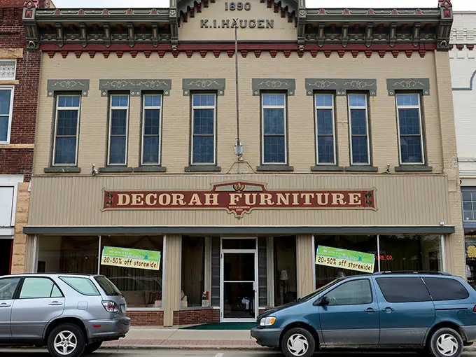 Downtown Decorah welcomes cyclists with historic charm and modern amenities. The beautifully preserved buildings house local treasures like Rubaiyat restaurant.