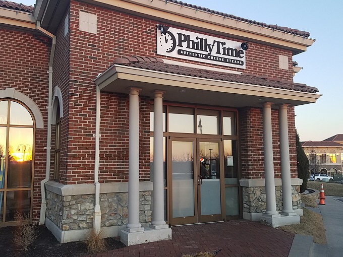 The stately brick exterior of Philly Time stands like a temple to sandwich perfection, complete with columns that say "We take our cheesesteaks seriously."