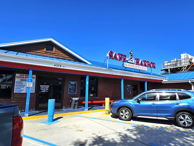 The blue roof and bold red signage beckon like a lighthouse for hungry souls. Simplicity on the outside, seafood magic within.